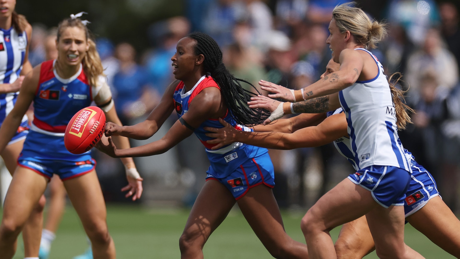 AFLW Report | Roos defy Dogs, wild weather